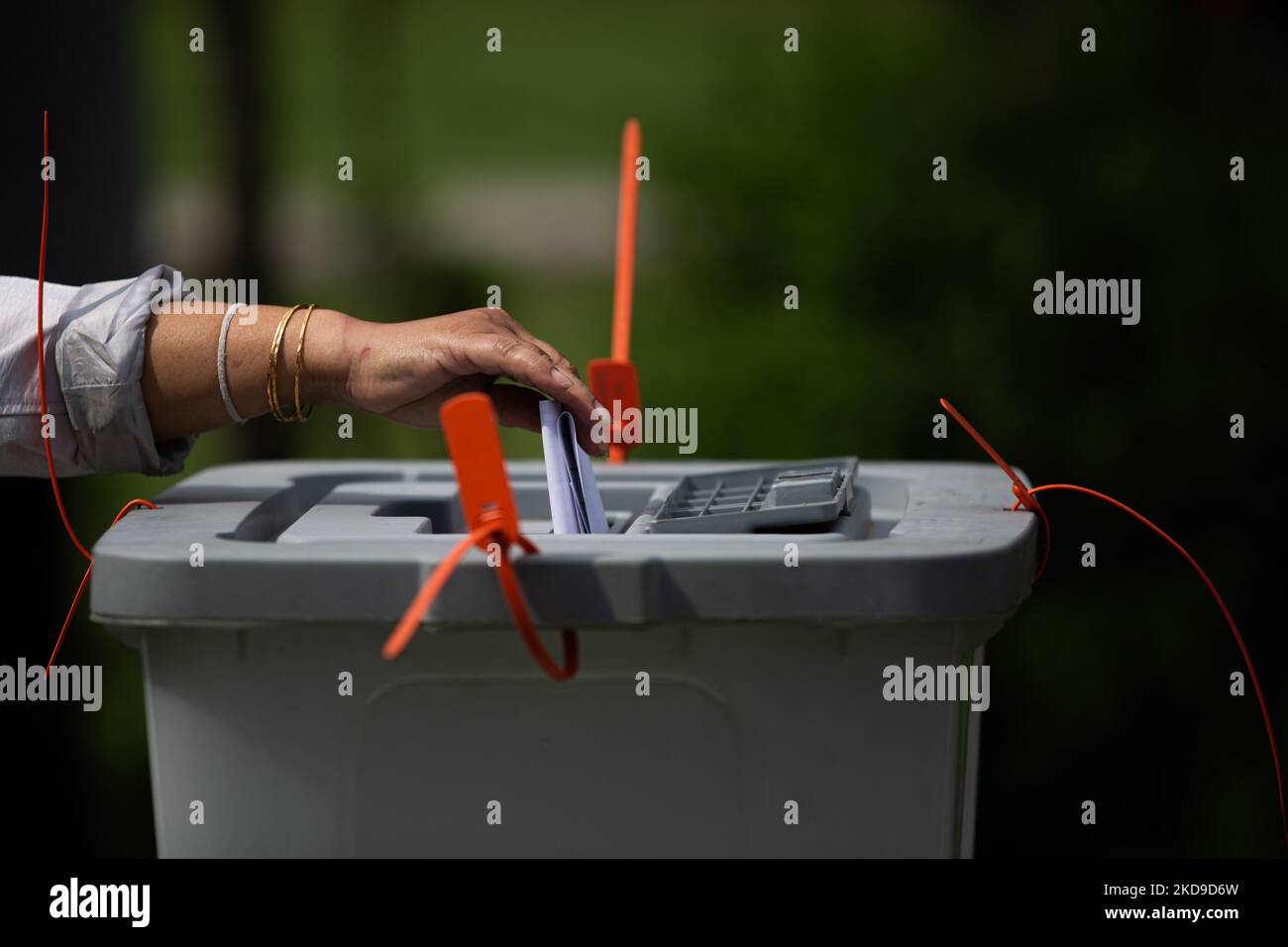 A woman casts her vote during a mock voting exercise ahead of the ...