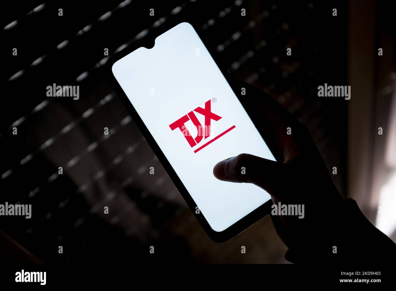 In this photo illustration a TJX Companies logo seen displayed on a ...
