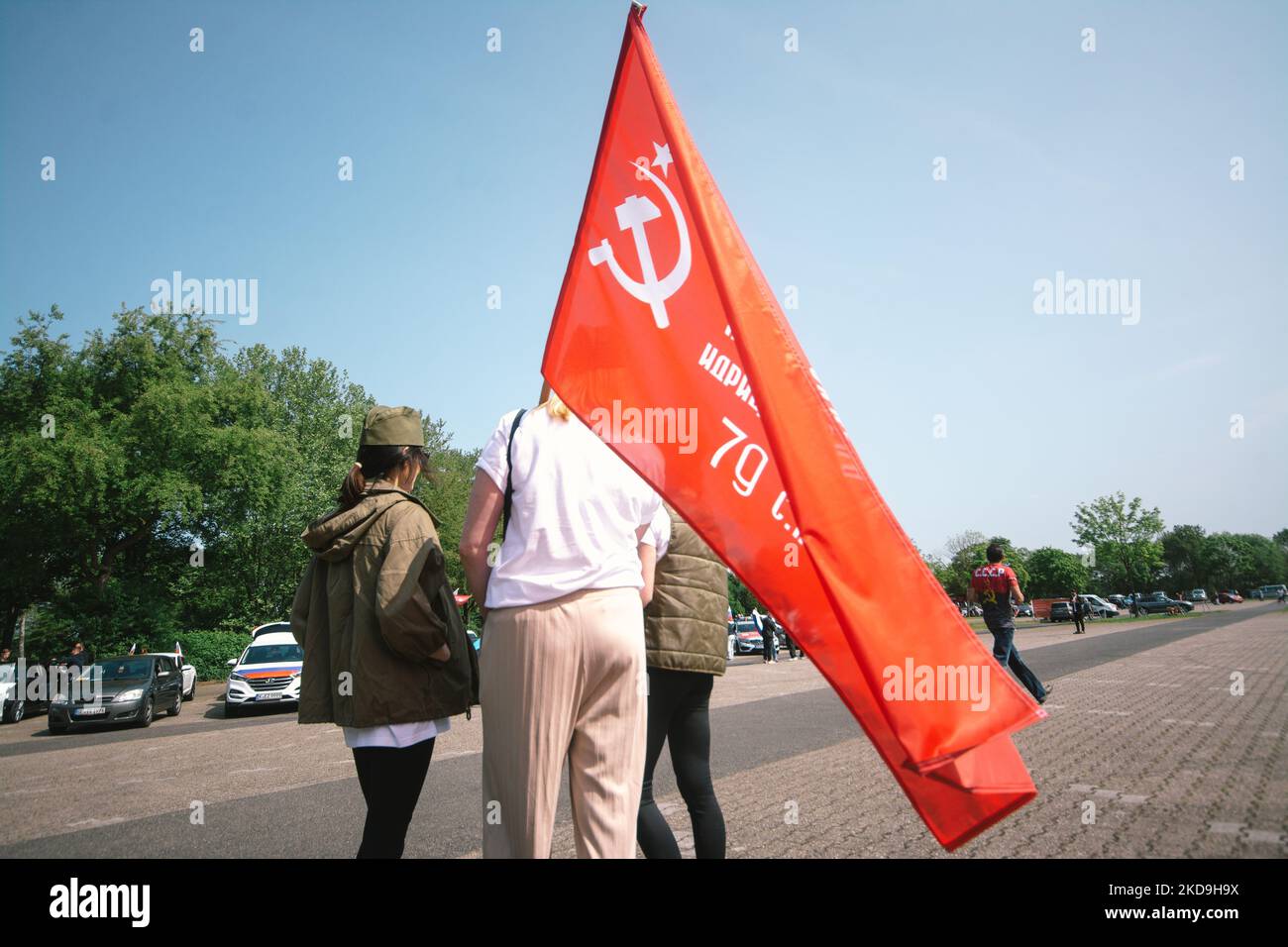 people carries communist flag with hammer are seen before the start of ...