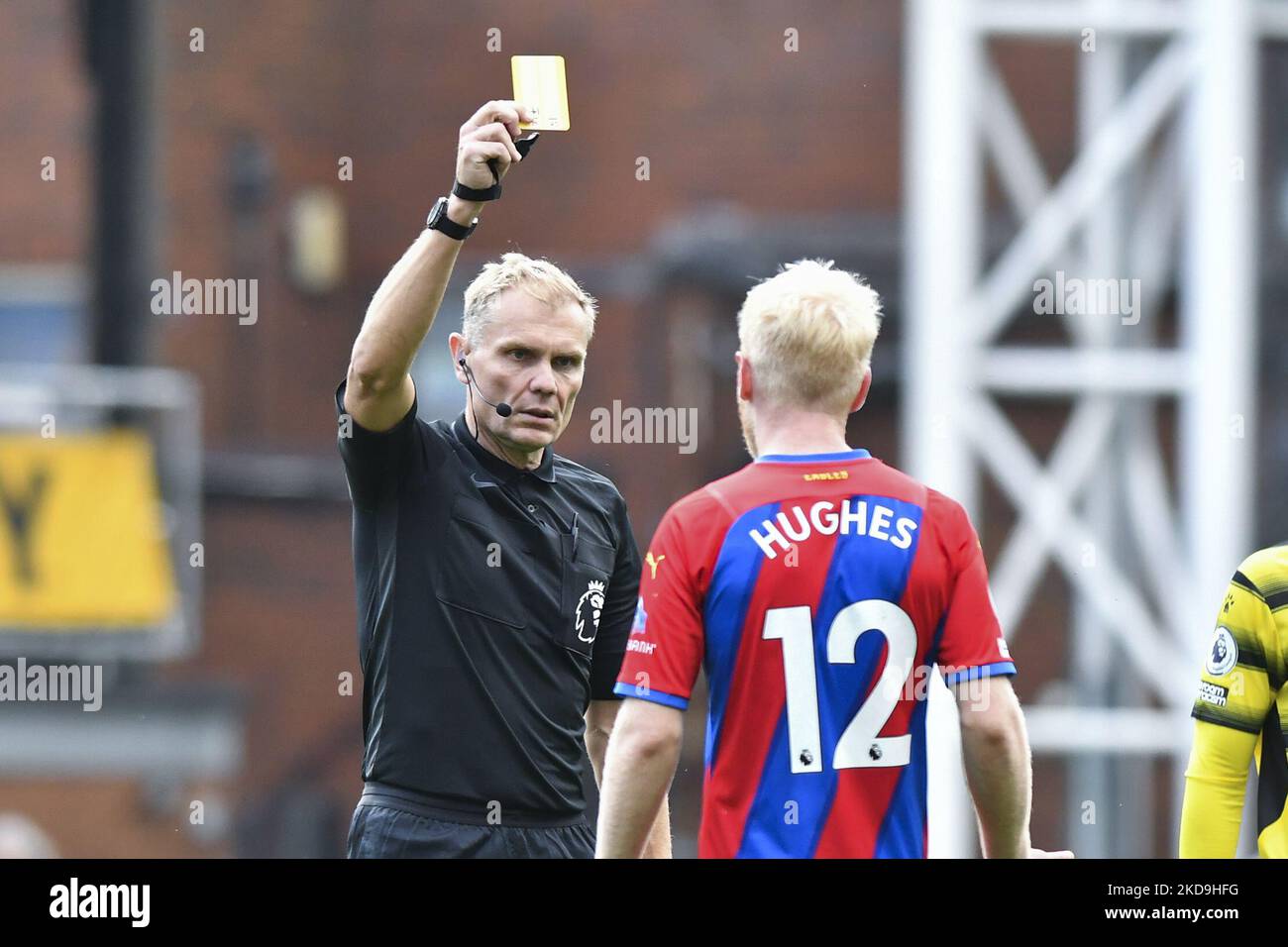 Will Hughes of Crystal Palace is shown a yellow card by the referee ...