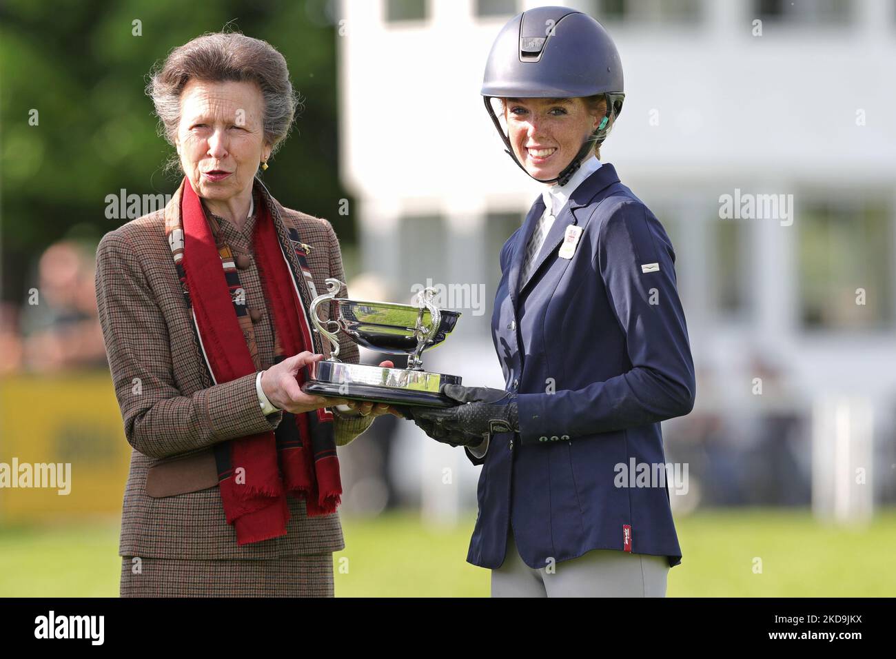 Princess Anne awards a trophy to the youngest rider Alice Casburn ...