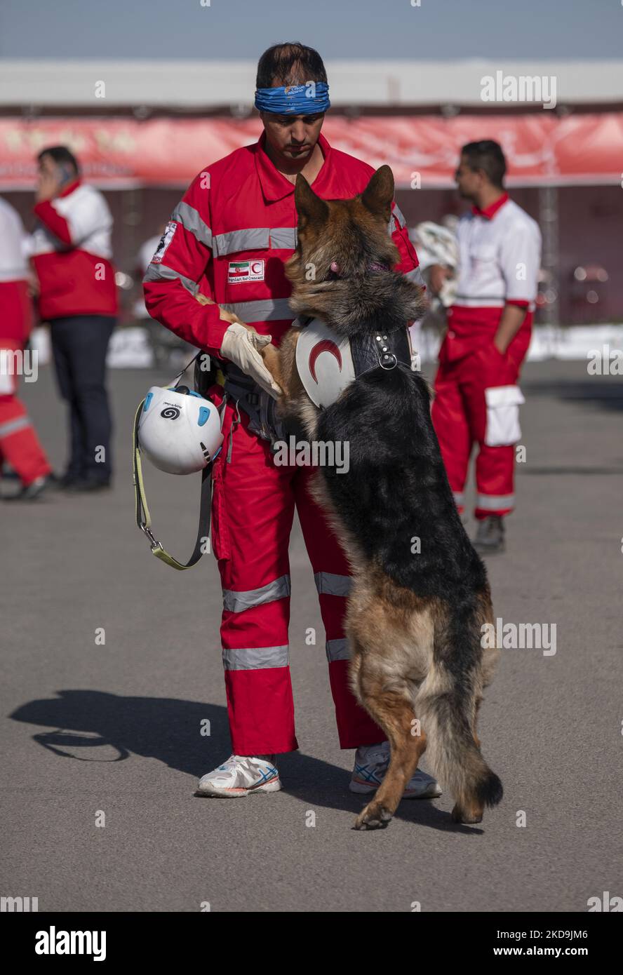 A member of the Iranian Red Crescent Society and a search and rescue ...