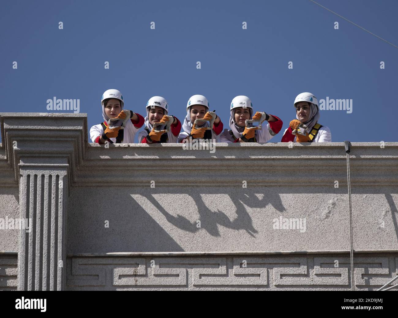 Female members of the Iranian Red Crescent Society demonstrate the ...