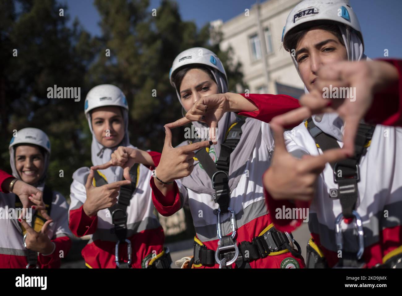 Female members of the Iranian Red Crescent Society demonstrate the ...