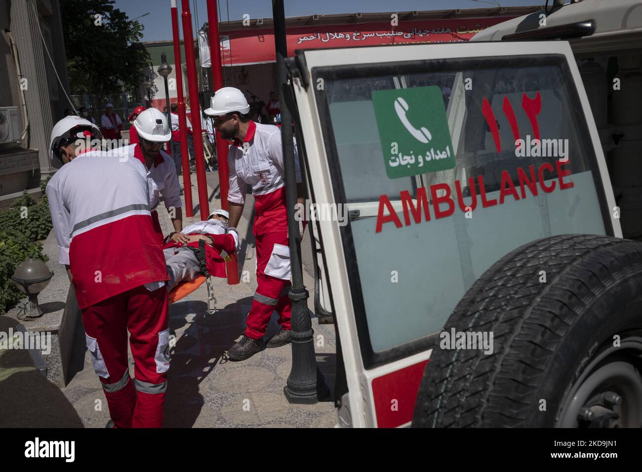 Members of the Iranian Red Crescent Society perform in a ceremony ...
