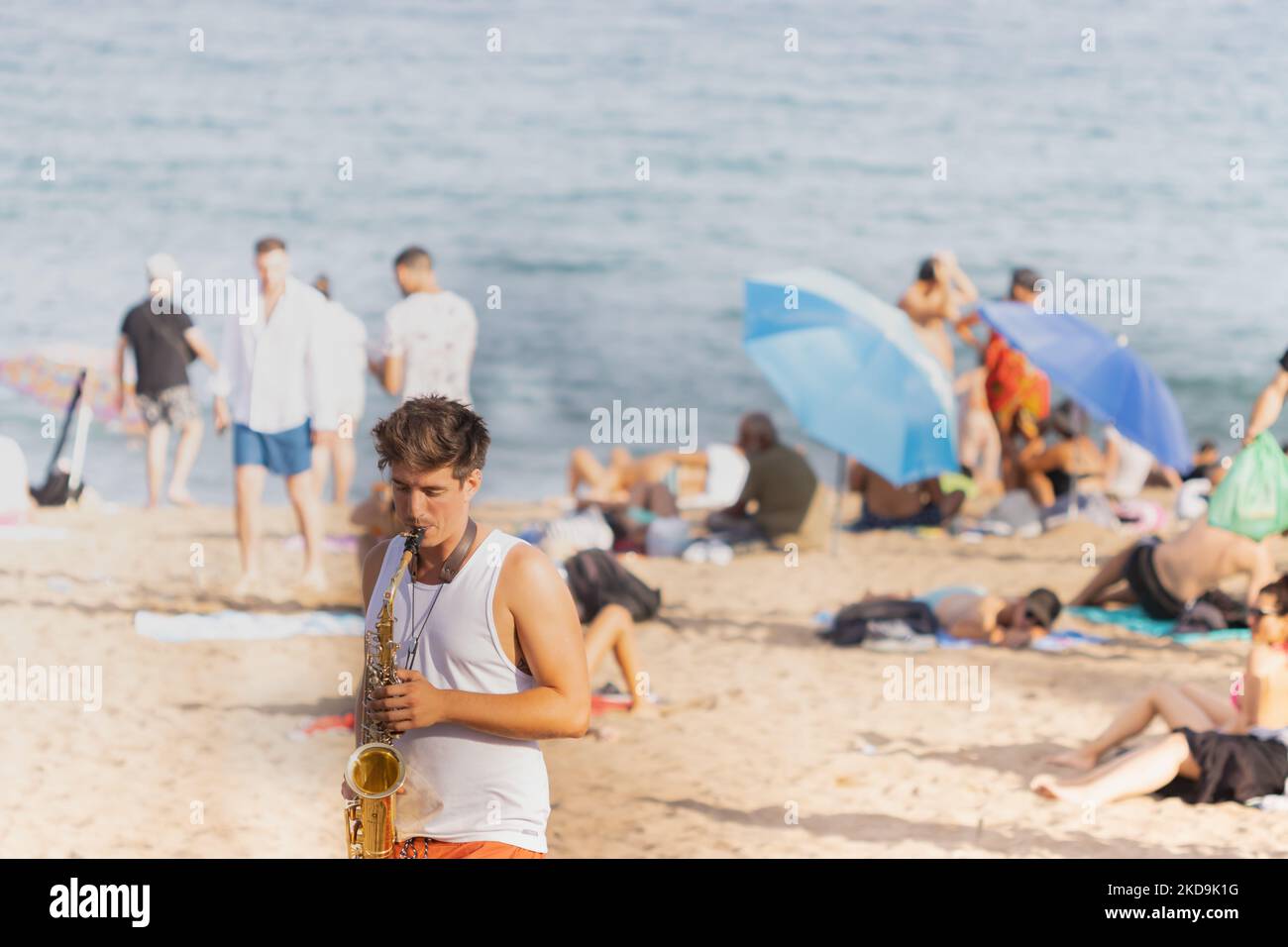 Barcelona, Spain - August 27, 2022: musician on the beach playing ...