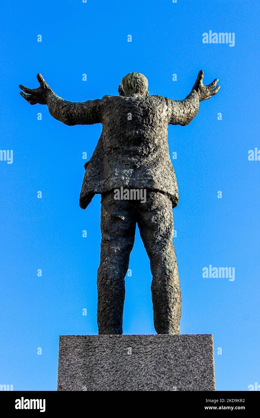 A low angle shot of Jim Larkin Sculpture rear view against a blue sky ...