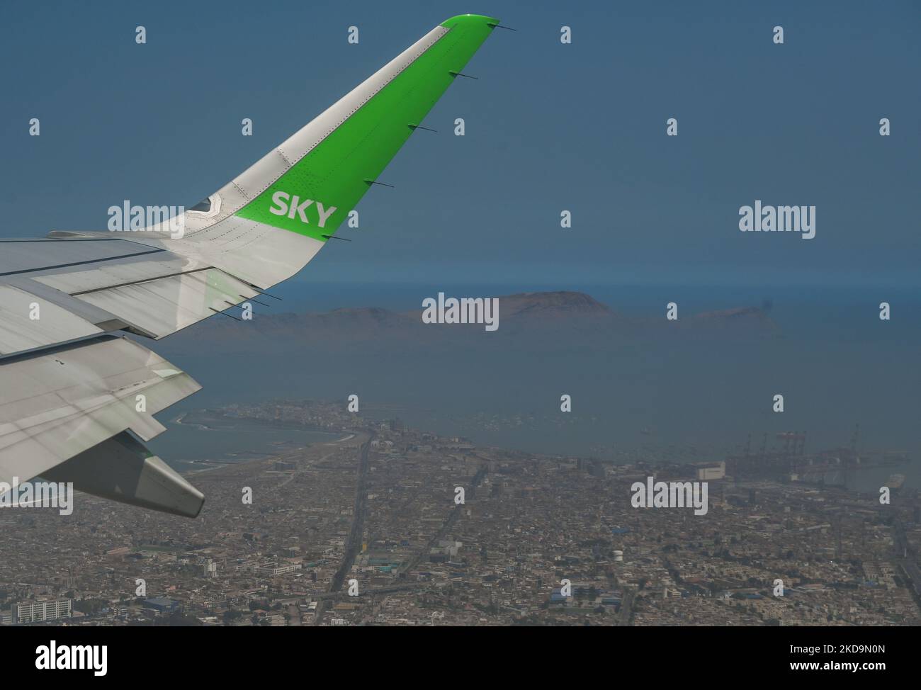 SKY Airline plane flies over LIma near Jorge Chavez International ...