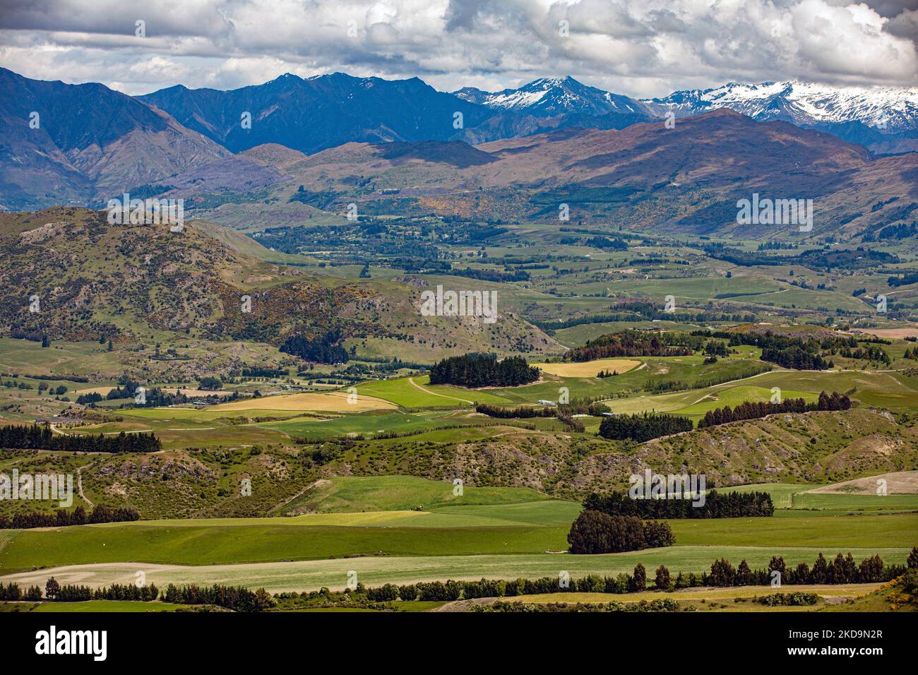 An aerial shot of farms and landscapes in the New Zealand BackCountry ...