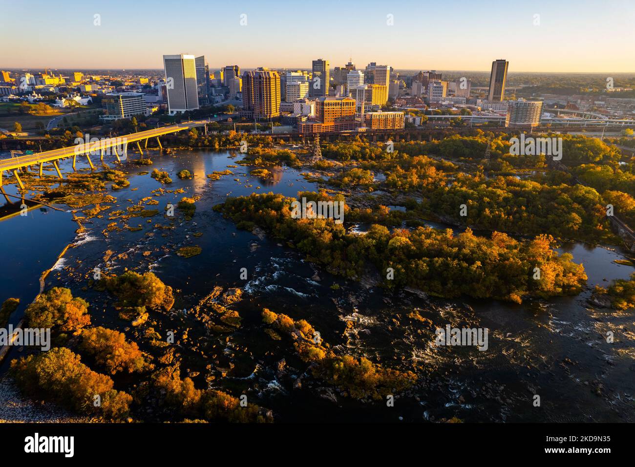 An aerial view of a beautiful orange sunrise over the James River ...