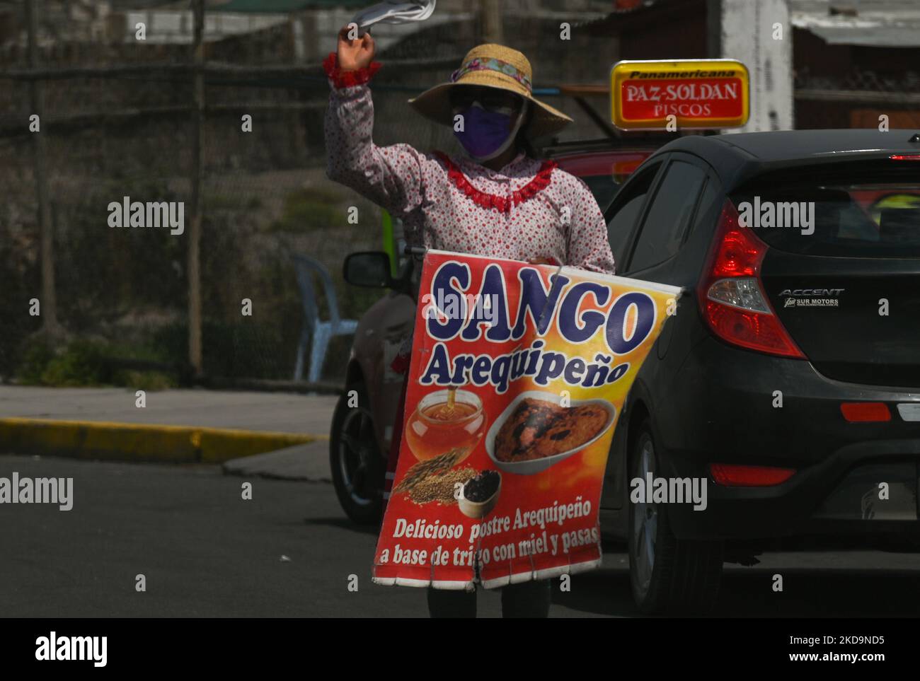 A local woman advertising 'Sango de Trigo Arequipeno' - a local dessert ...