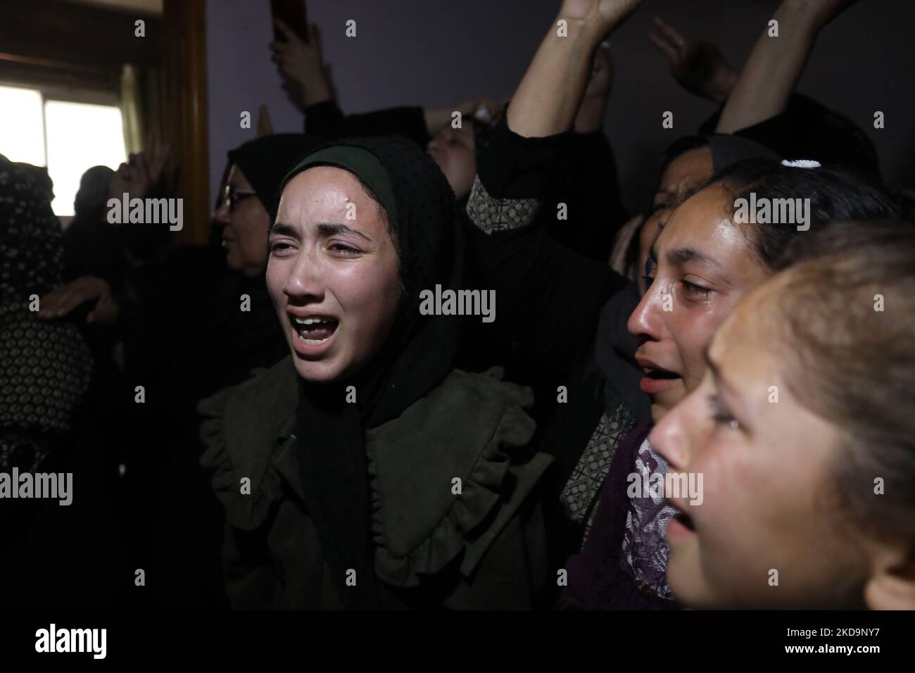 Mourners react on May 11, 2022, during the funeral in Khan Younis in ...