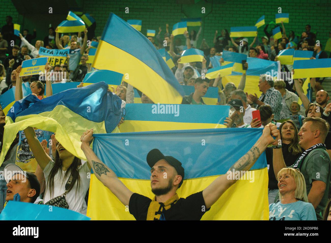 Ukraine football fans with Ukrainian flags are seen in the stadium of ...