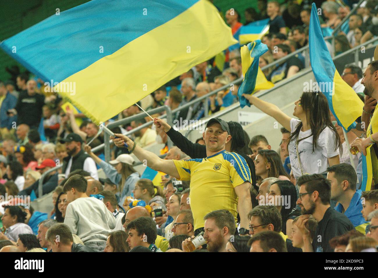 Ukraine football fans with Ukrainian flags are seen in the stadium of ...