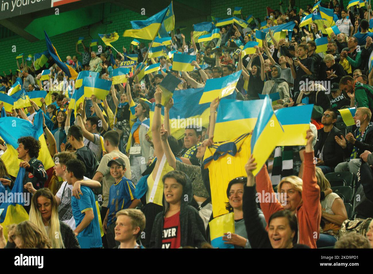 Ukraine football fans with Ukrainian flags are seen in the stadium of ...