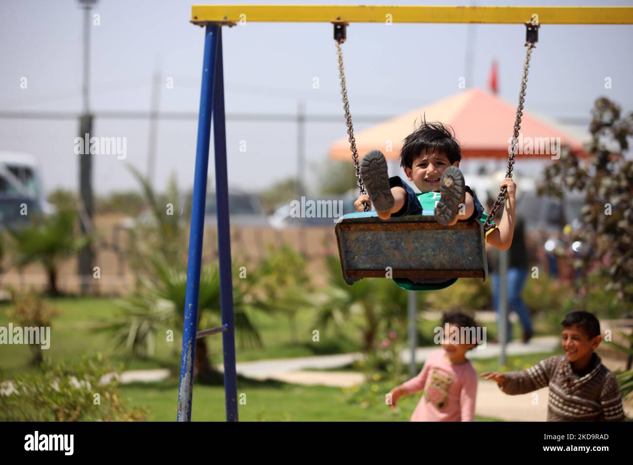 Palestinian children play at a park in Gaza City, on May 12, 2022 ...