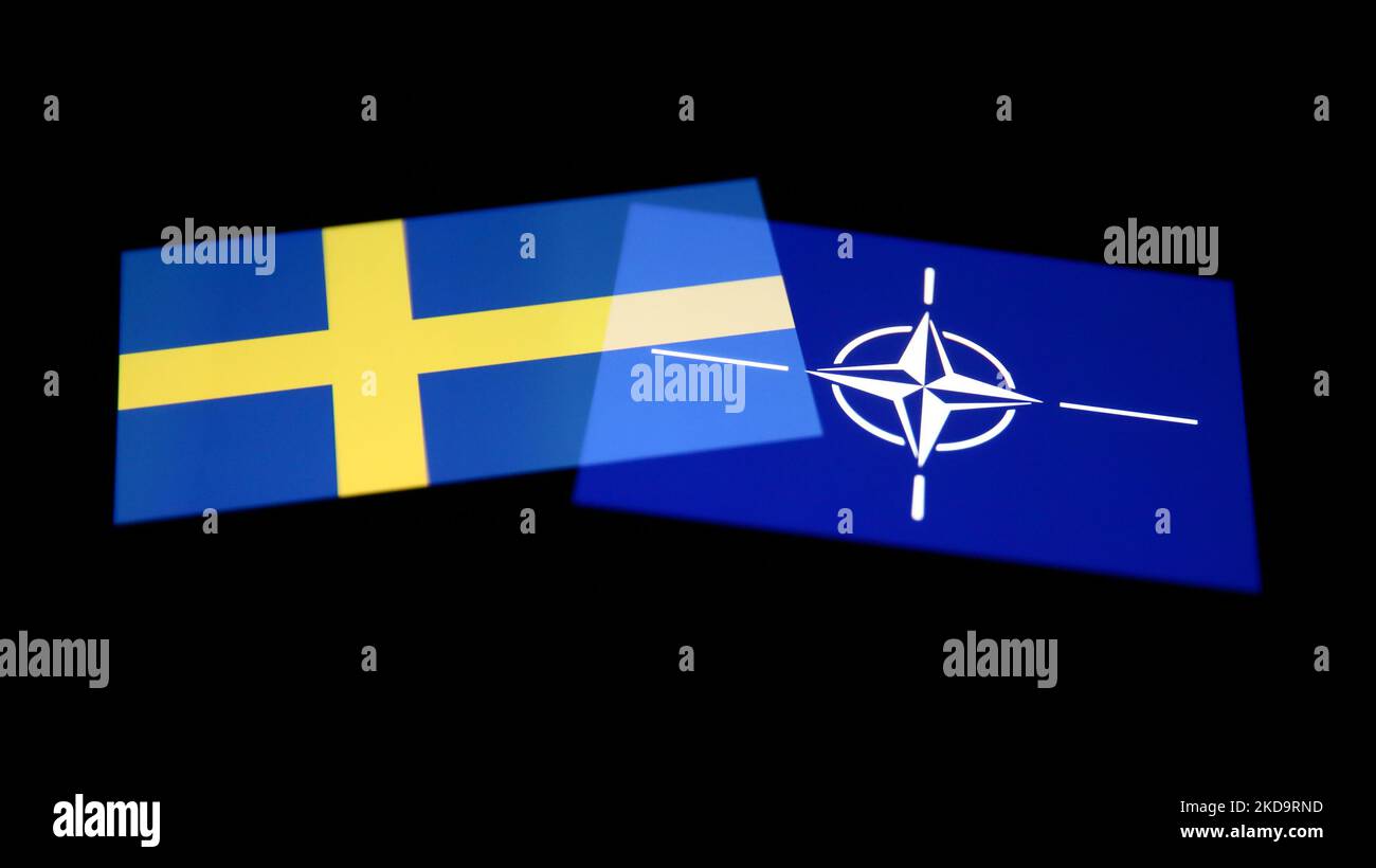 Flags of Sweden and NATO are seen displayed on phone screens in this ...
