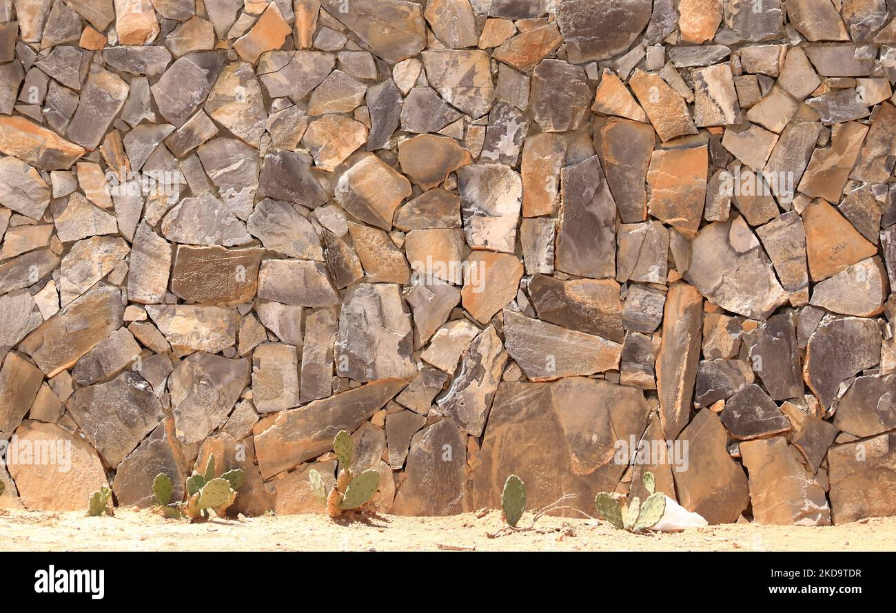 a Grey Yellow Stonewall Made From Flagstone And Sandstone Slabs ...