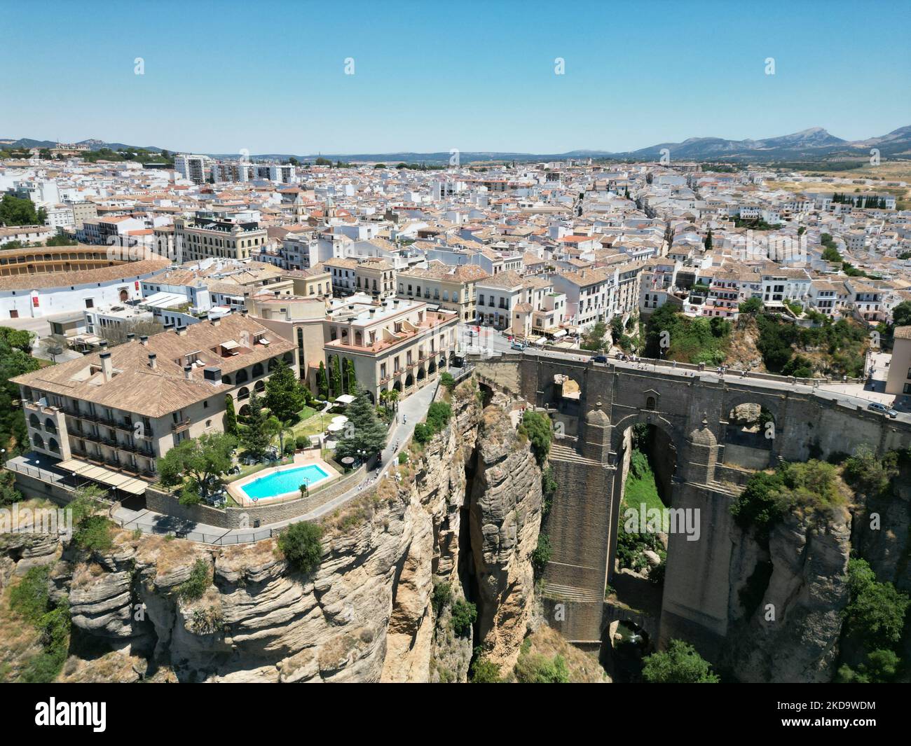 An aerial view of cityscape Ronda surrounded by buildings Stock Photo ...