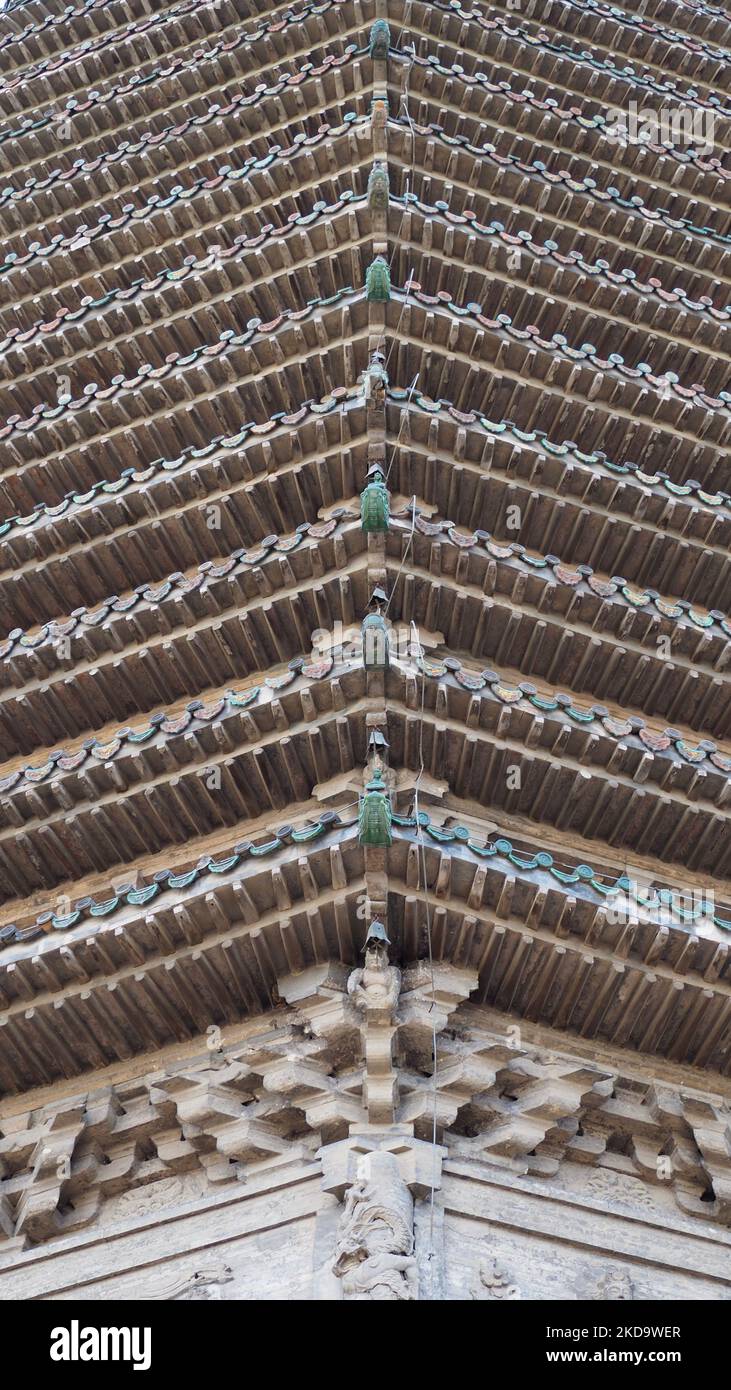 A vertical shot of Chinese architecture temple with design in daylight ...