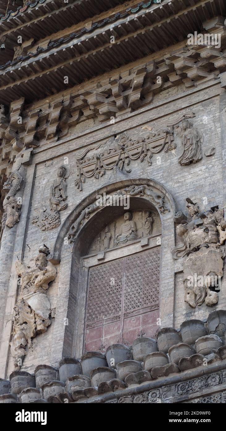 A vertical shot of Chinese architecture temple with design in daylight ...