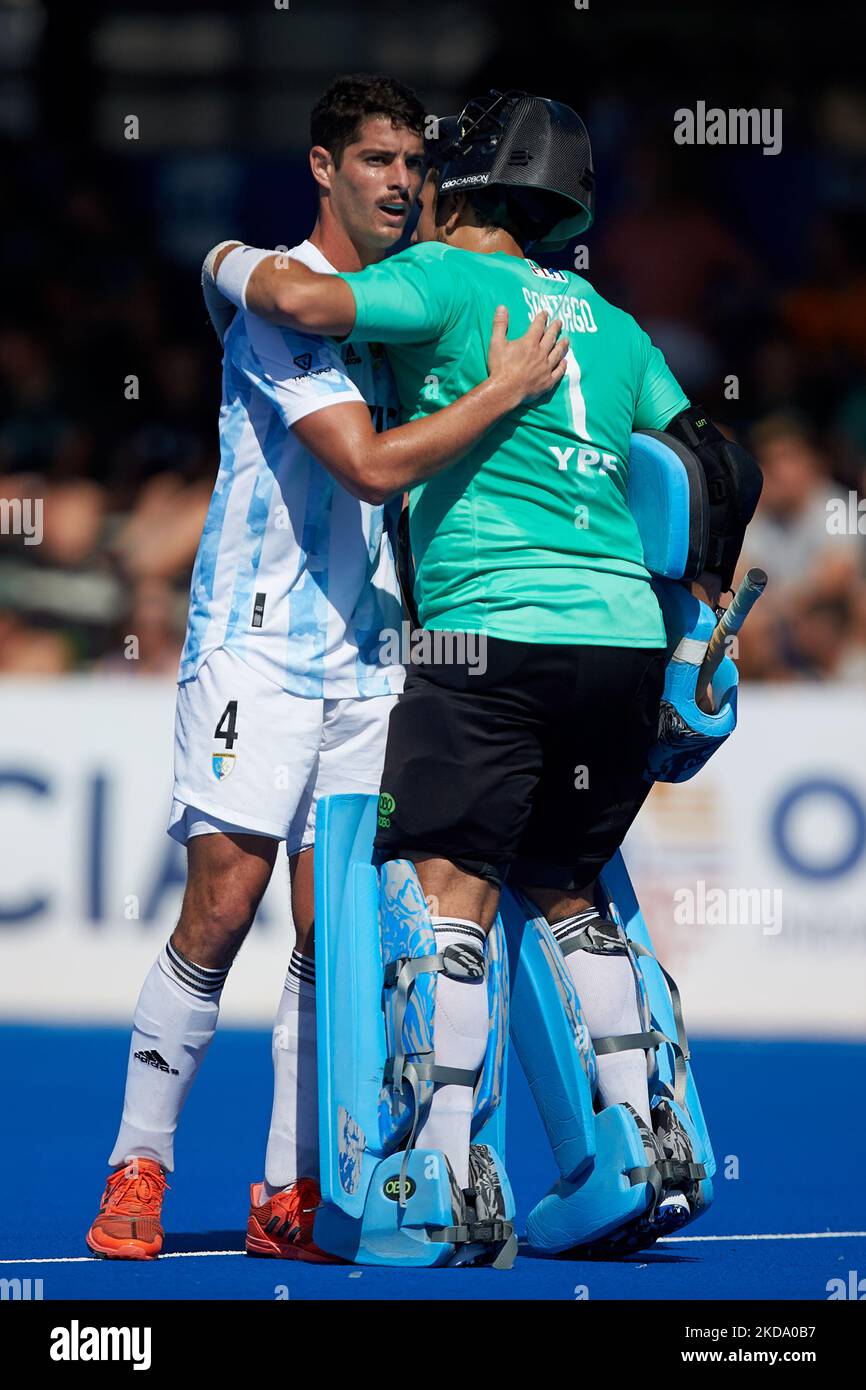 Juan Catan (L) of Argentina hugs his teammate Tomas Santiago during the ...