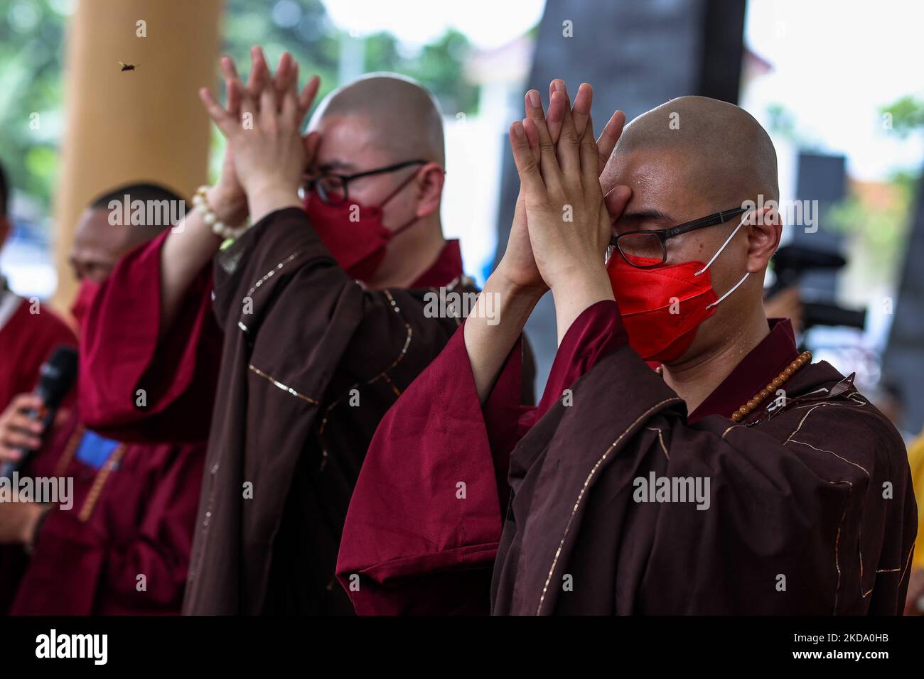 Buddhist monks offer prayers during Api Abadi Mrapen procession as a ...
