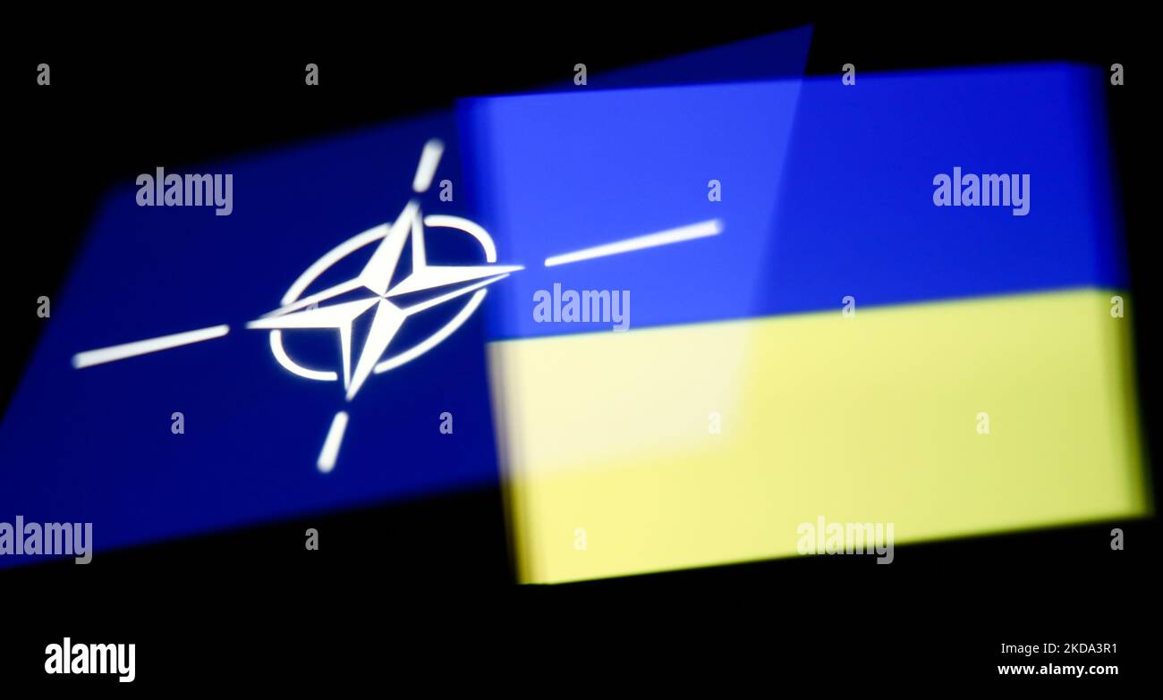 Flags of NATO and Ukraine displayed on phone screens are seen in this ...