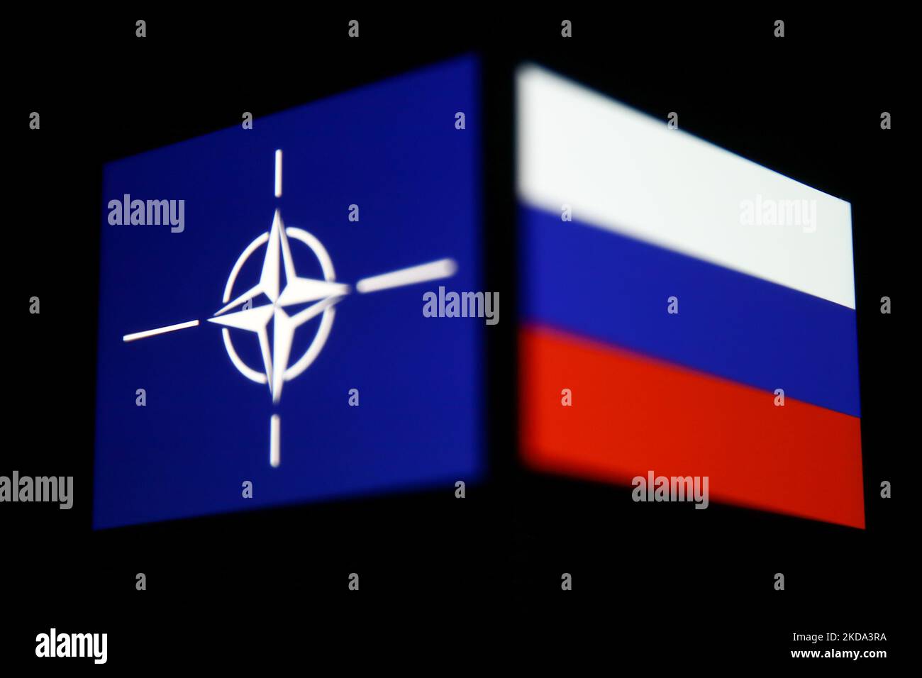 Flags of NATO and Russia displayed on phone screens are seen in this ...