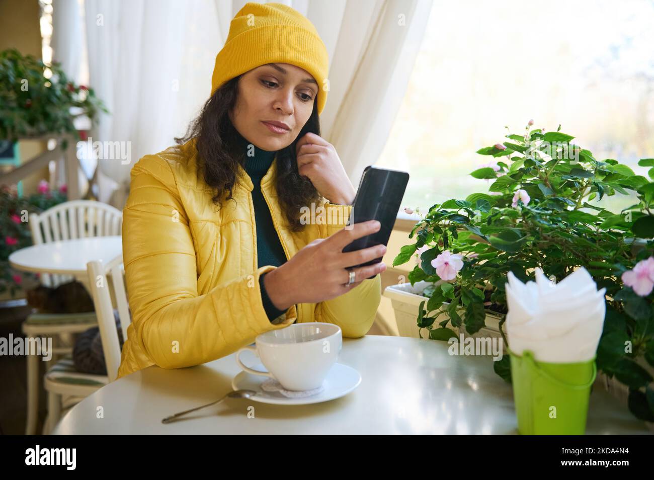 Woman post in coffee shop hi-res stock photography and images - Alamy