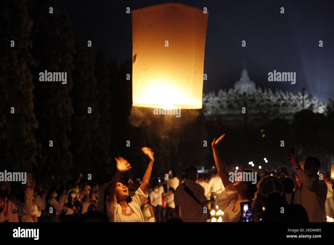Indonesian Buddhist release the lantern as a symbol of hope and peace for all mankind in the ...