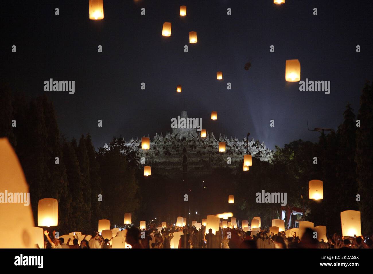 Indonesian Buddhist release the lantern as a symbol of hope and peace for all mankind in the ...