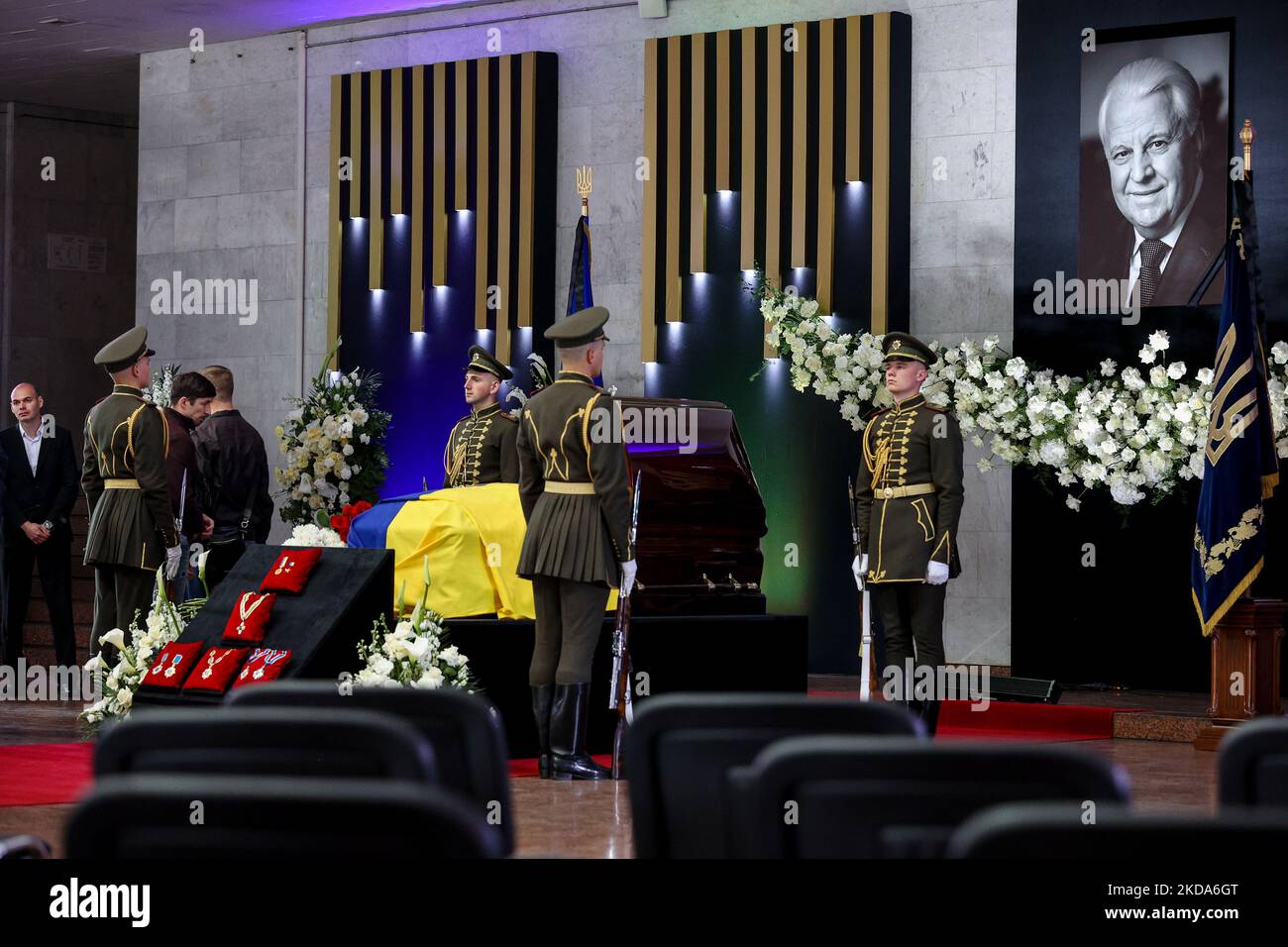 People lay flowers near the coffin with the body of Leonid Kravchuk in ...