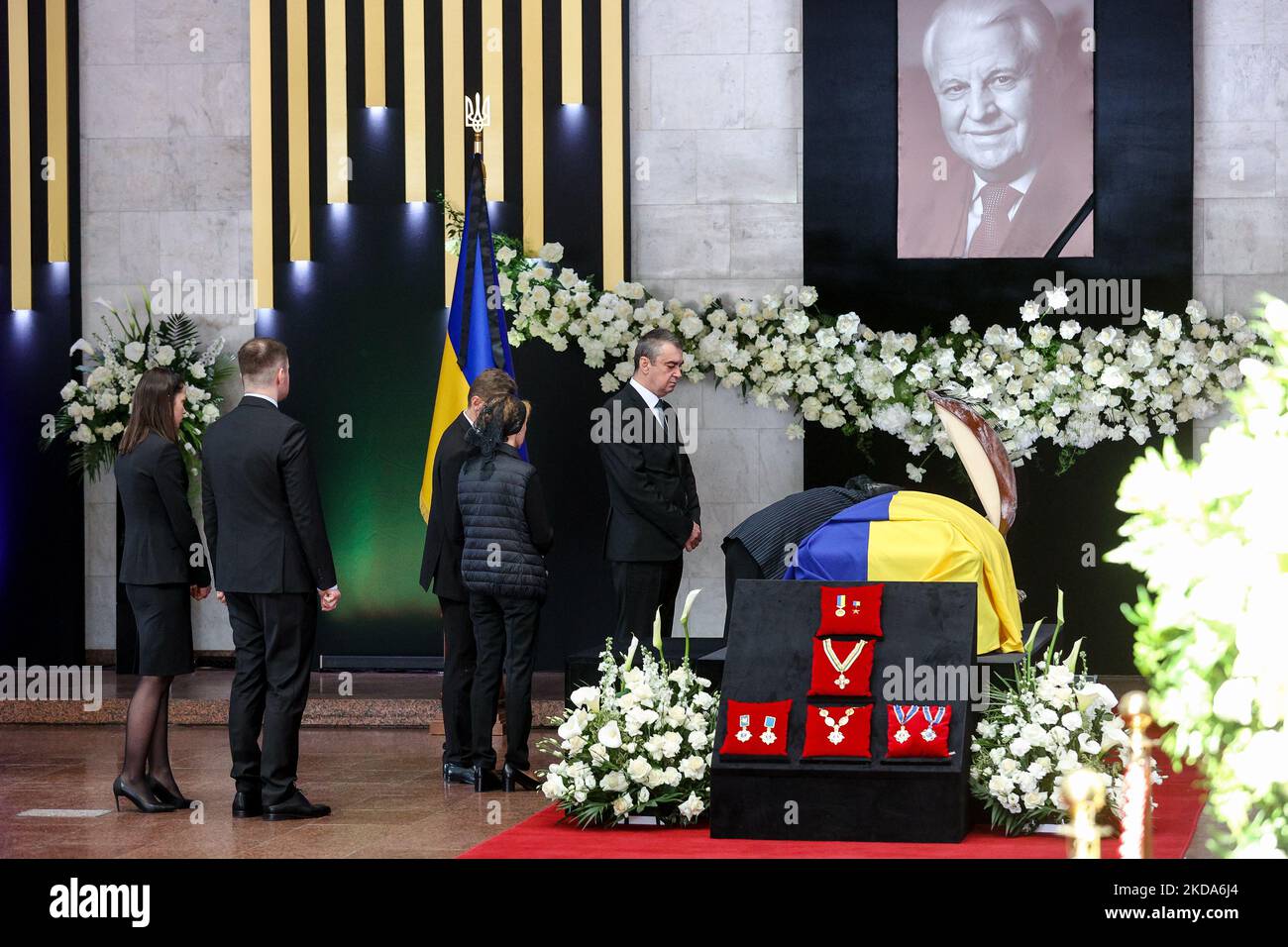 Family of the first President is seen near the coffin with the body of ...