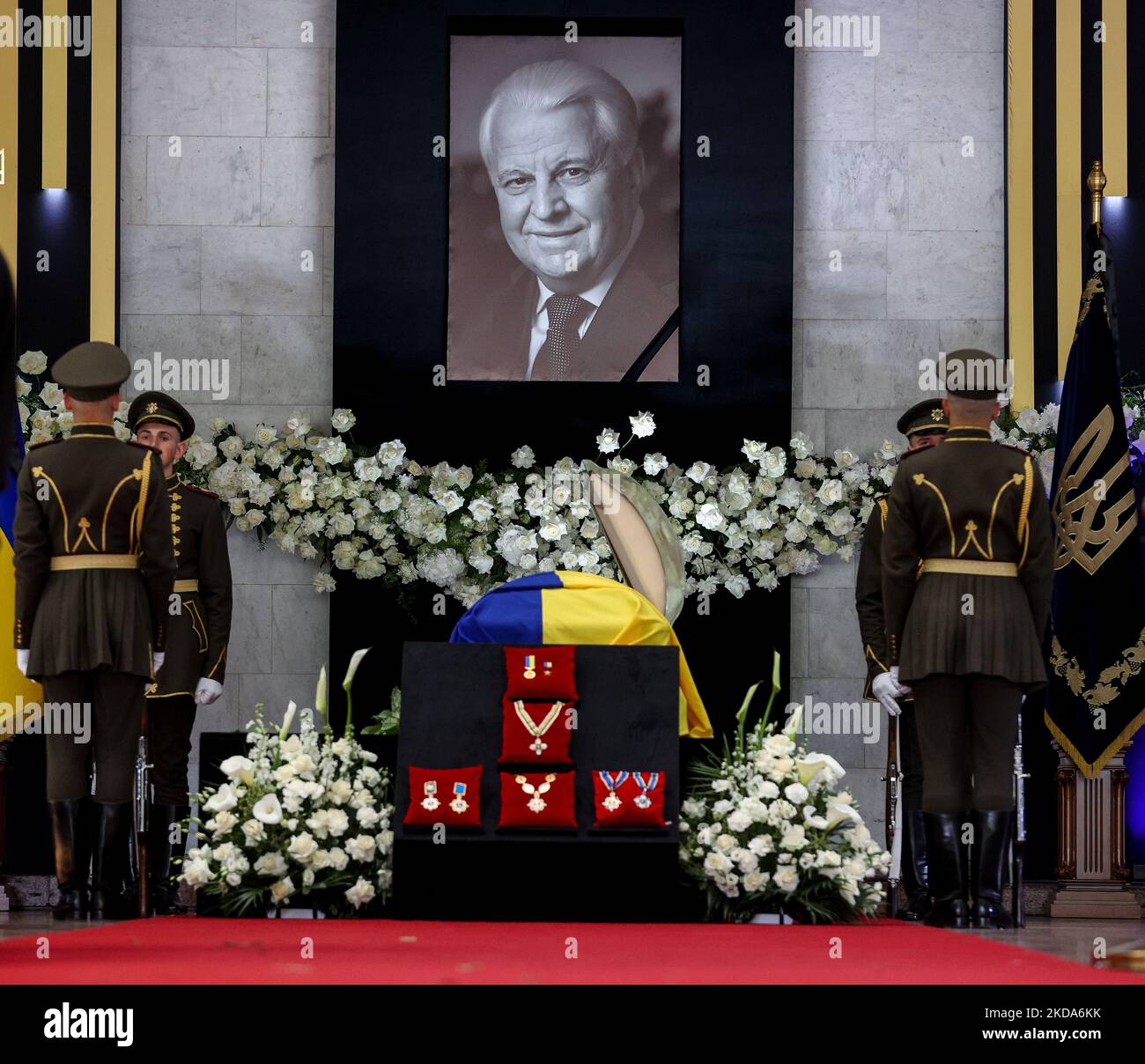 People lay flowers near the coffin with the body of Leonid Kravchuk in ...