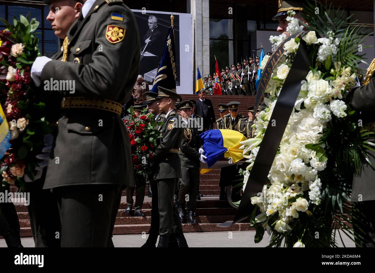Servicemen of Honor Guard carry the coffin with the body of the first ...