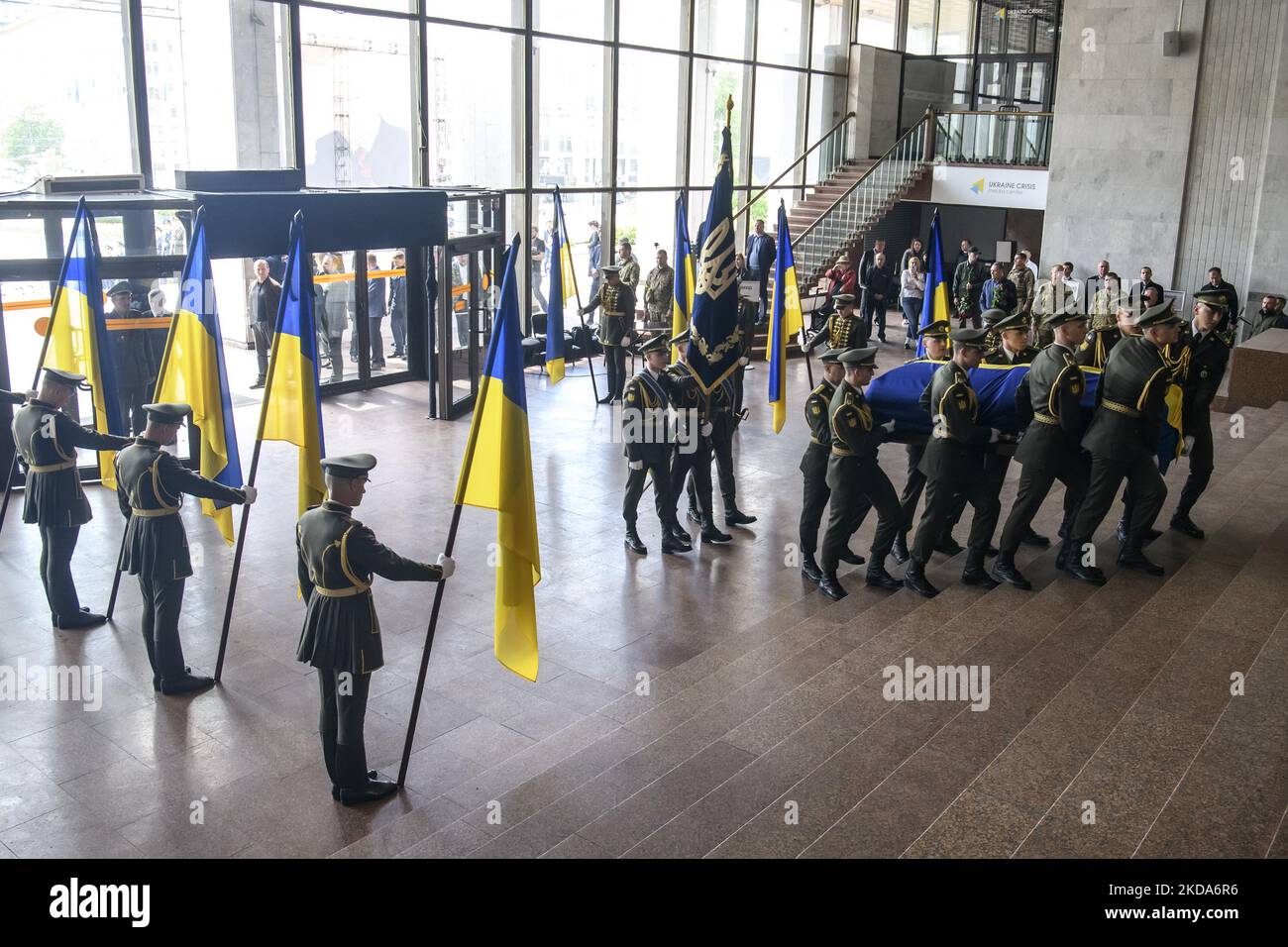 An honor guard carries the coffin of Ukrainian first president Leonid ...
