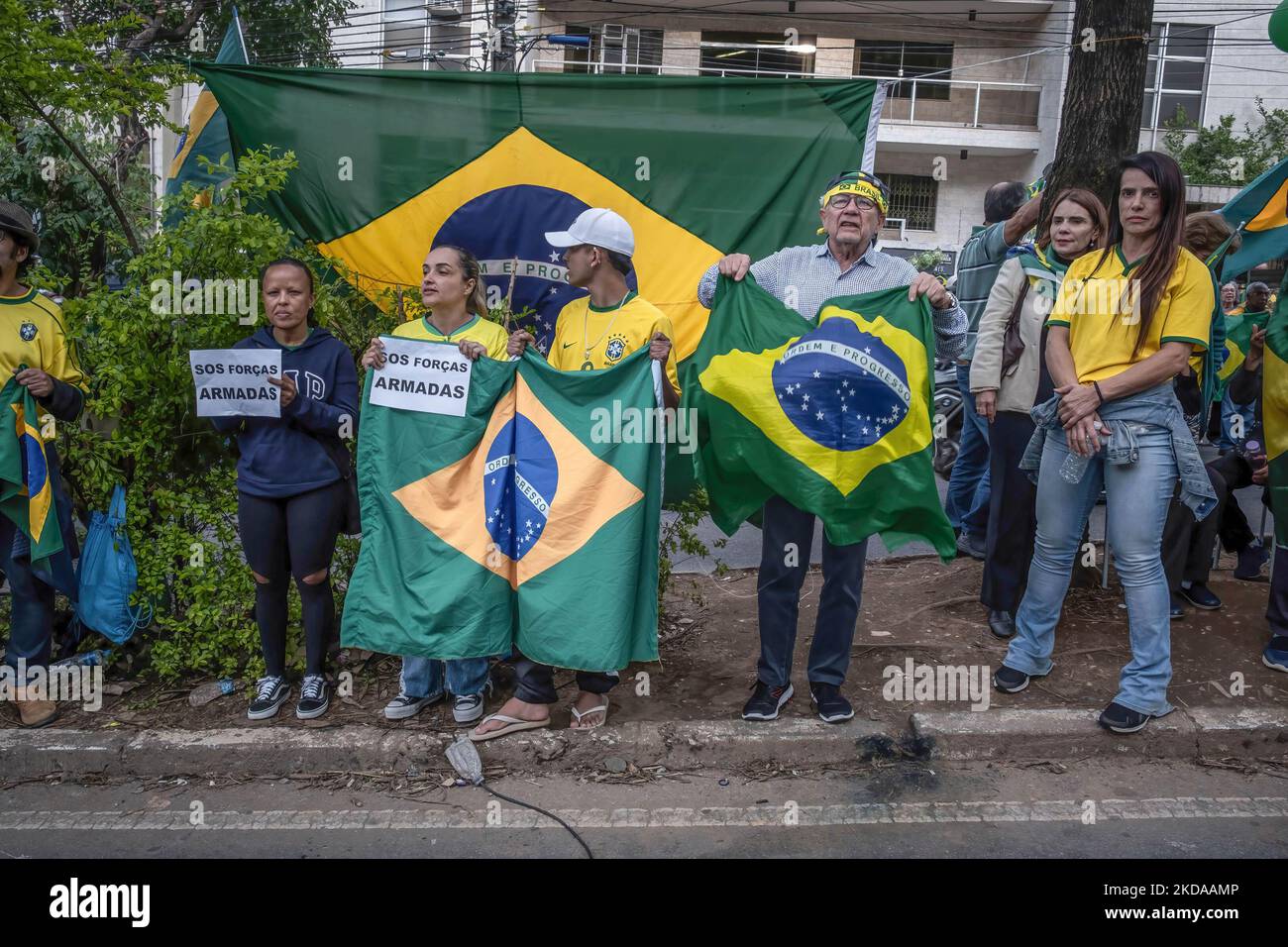Supporters of the far-right Brazilian president Jair Bolsonaro hold ...