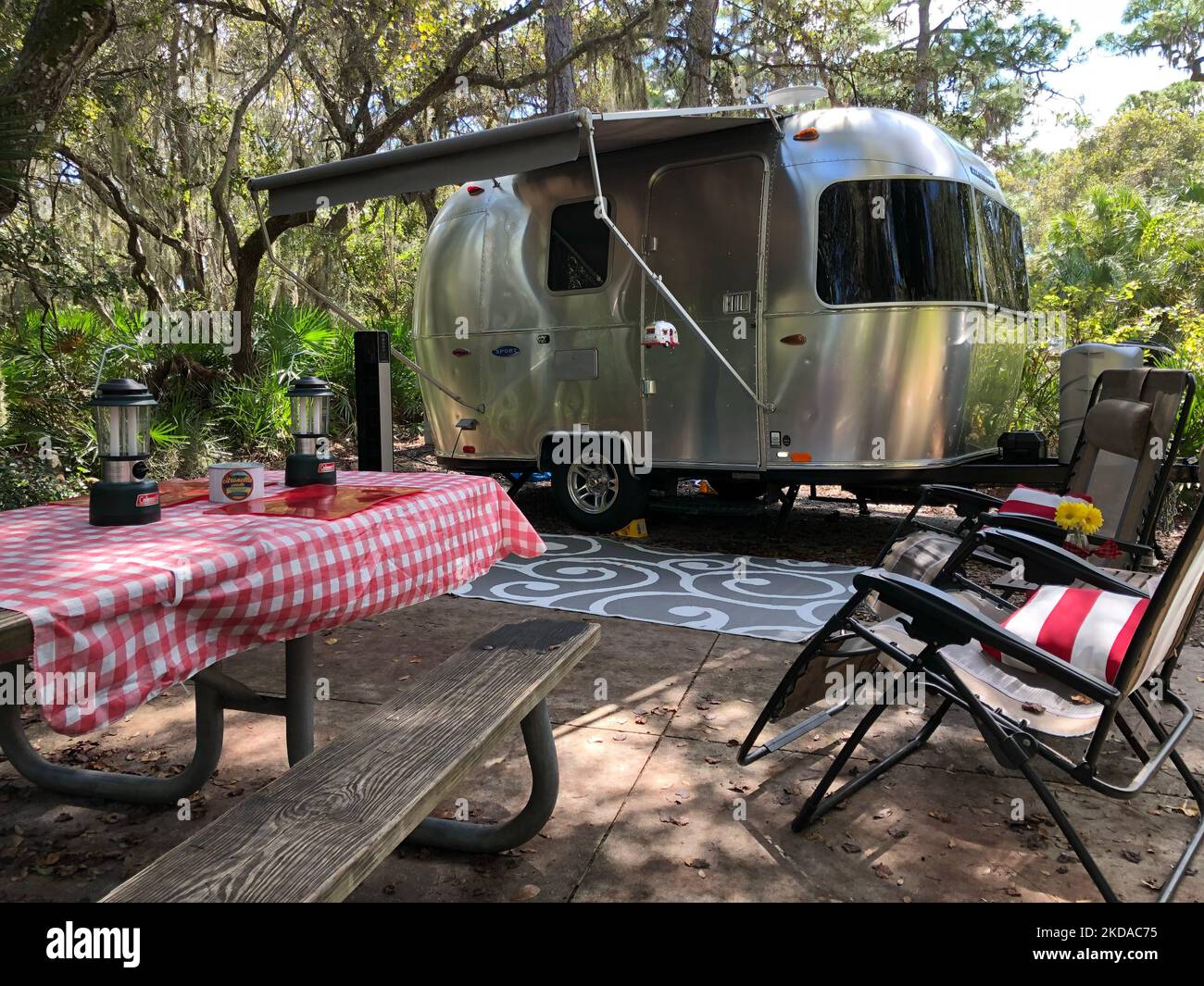 The trailer set-up with a picnic table in the Florida state park ...