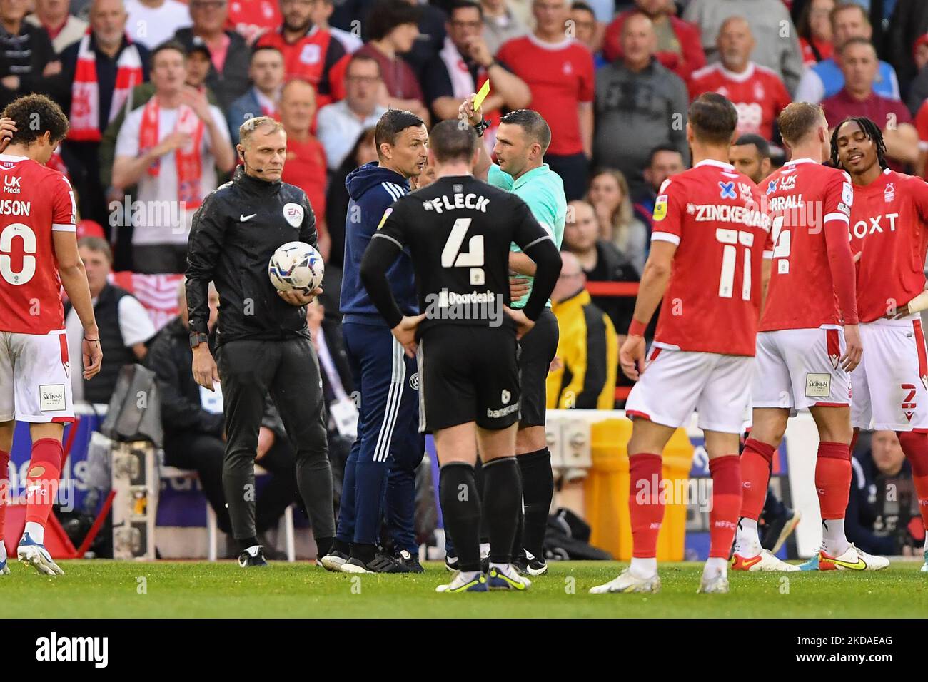 Referee, Michael Oliver shows a yellow card to Paul Heckingbottom ...