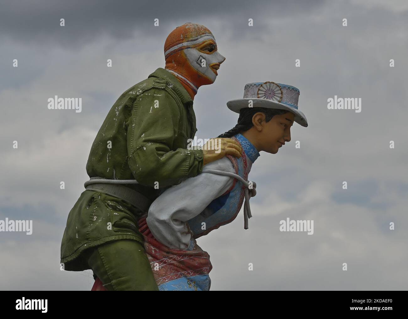 Statues of traditional dancers in the plaza at Maca town park. On ...