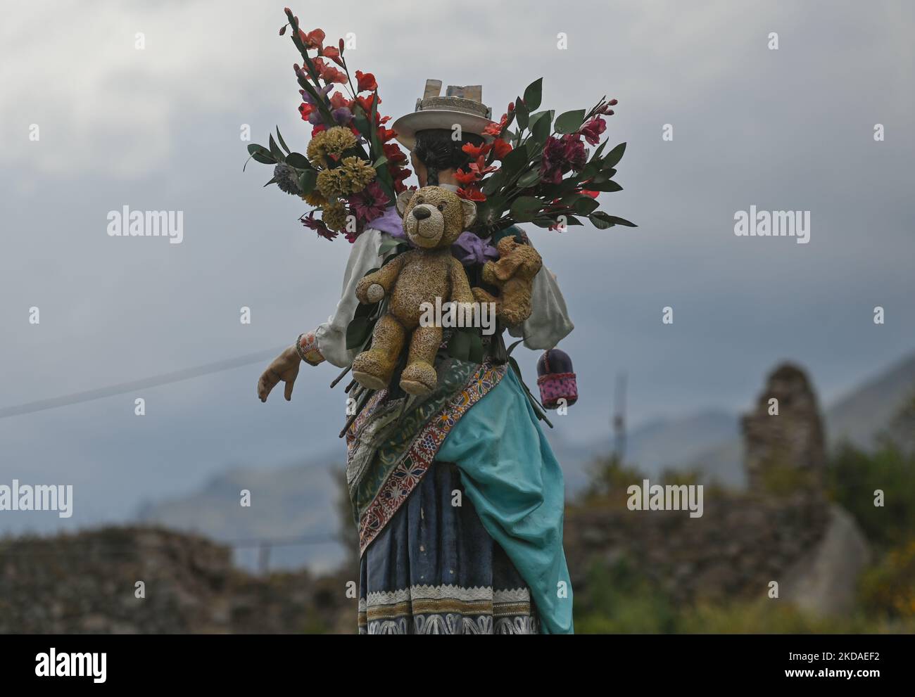 A statue of a woman wearing a traditional dress seen in the plaza at ...