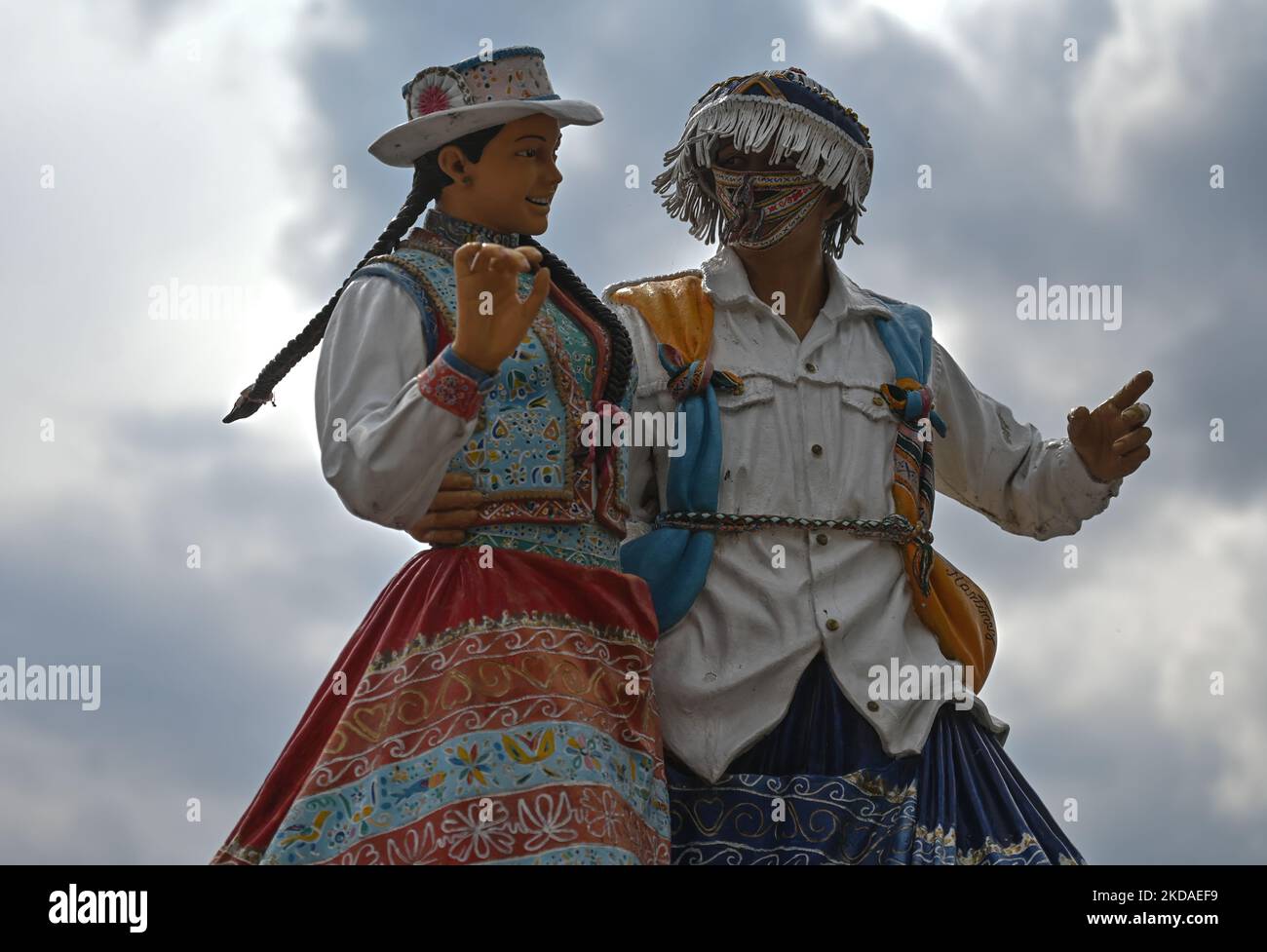 Statues of traditional dancers in the plaza at Maca town park. On ...