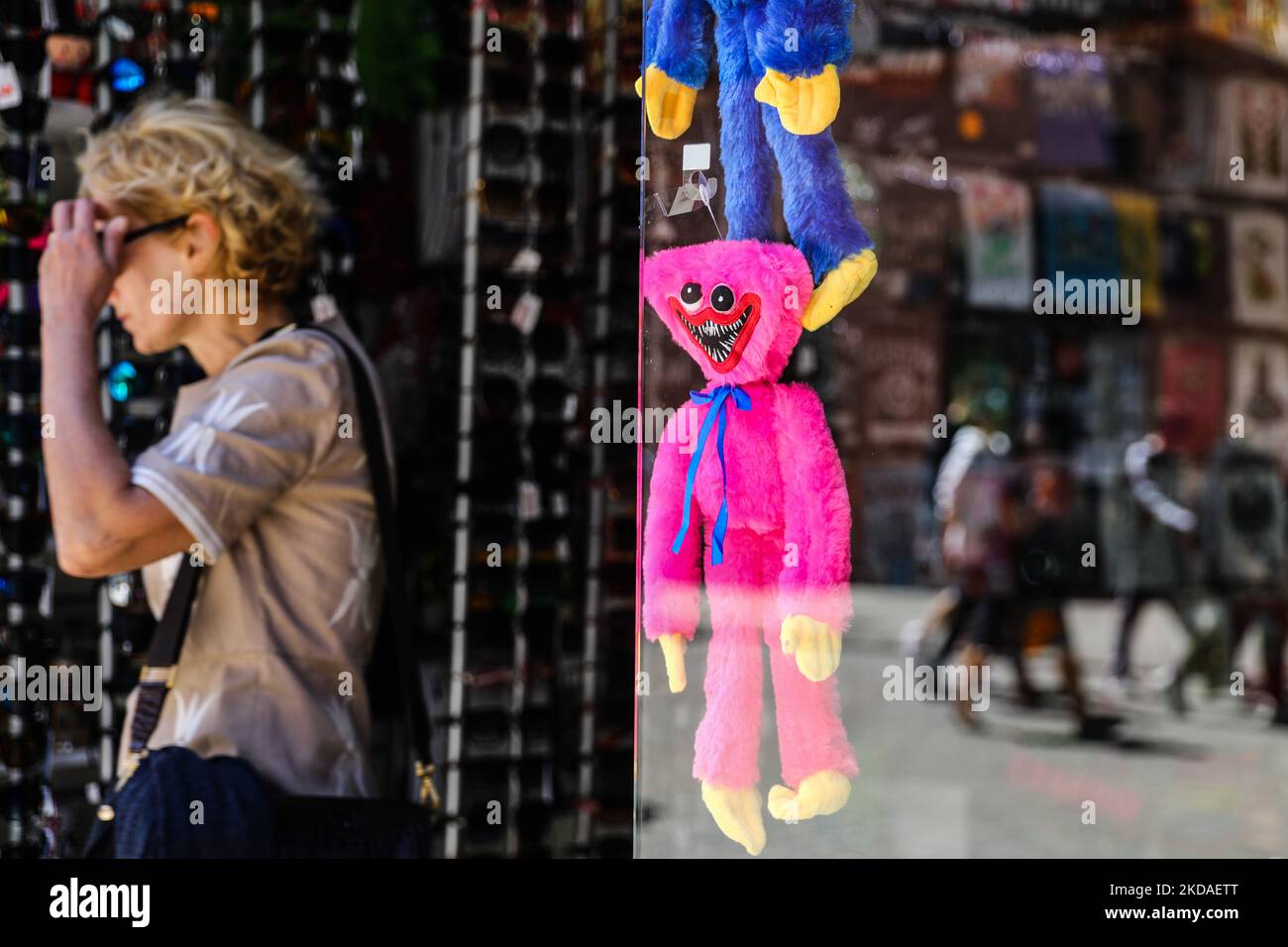 Huggy Wuggy mascots are being sold at a souvenir shop in the Old Town ...