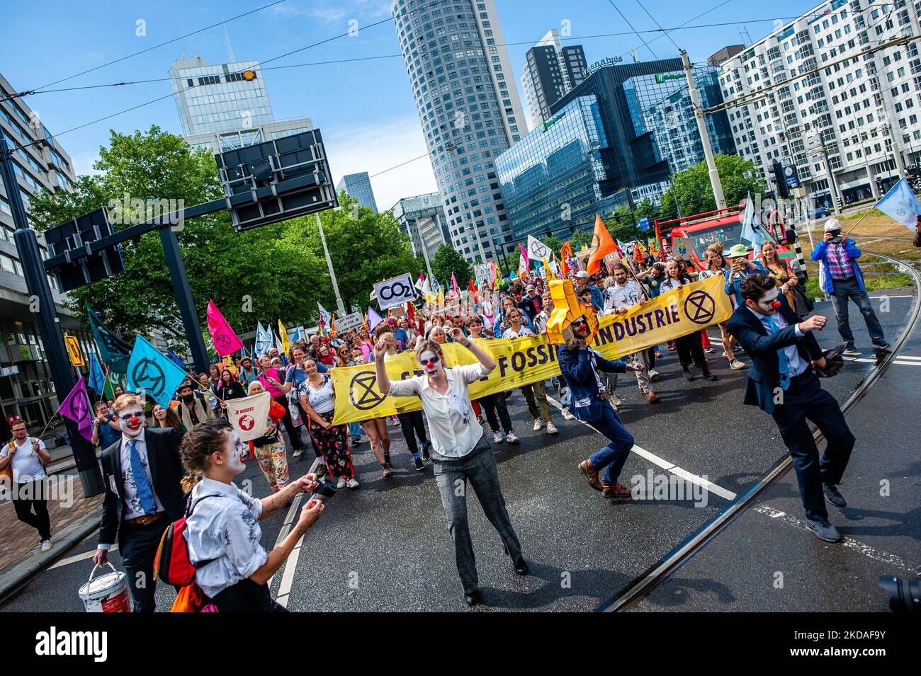 Hundreds of climate activists are walking through the center of ...