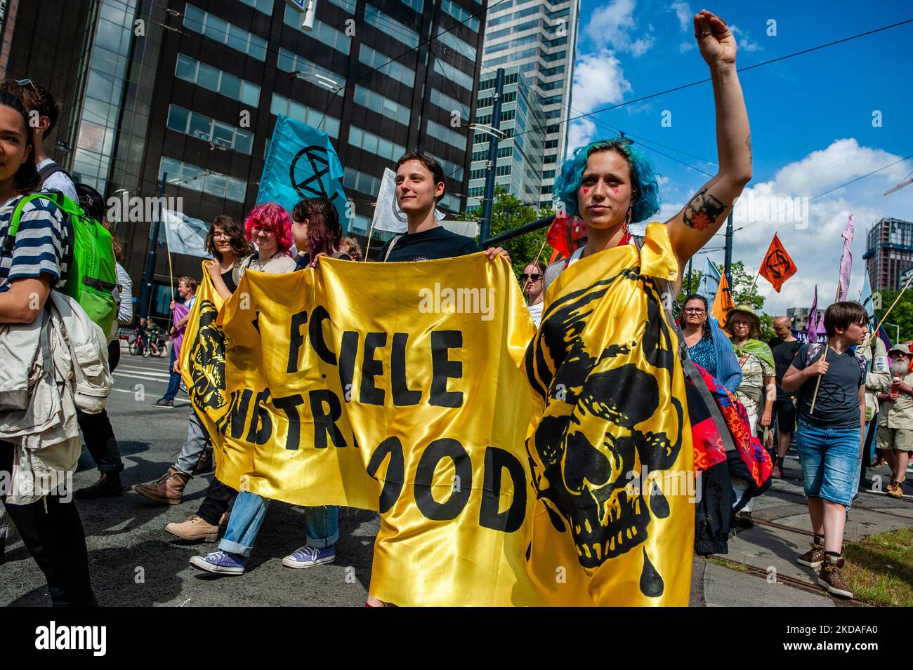 Hundreds of climate activists are walking through the center of ...