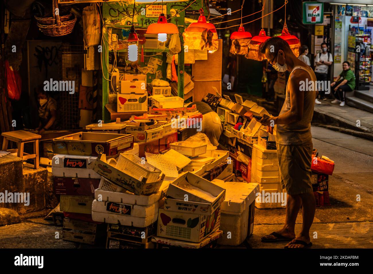 Hong Kong, China, 19 May 2022, A fruit vendor gets ready to shut down ...