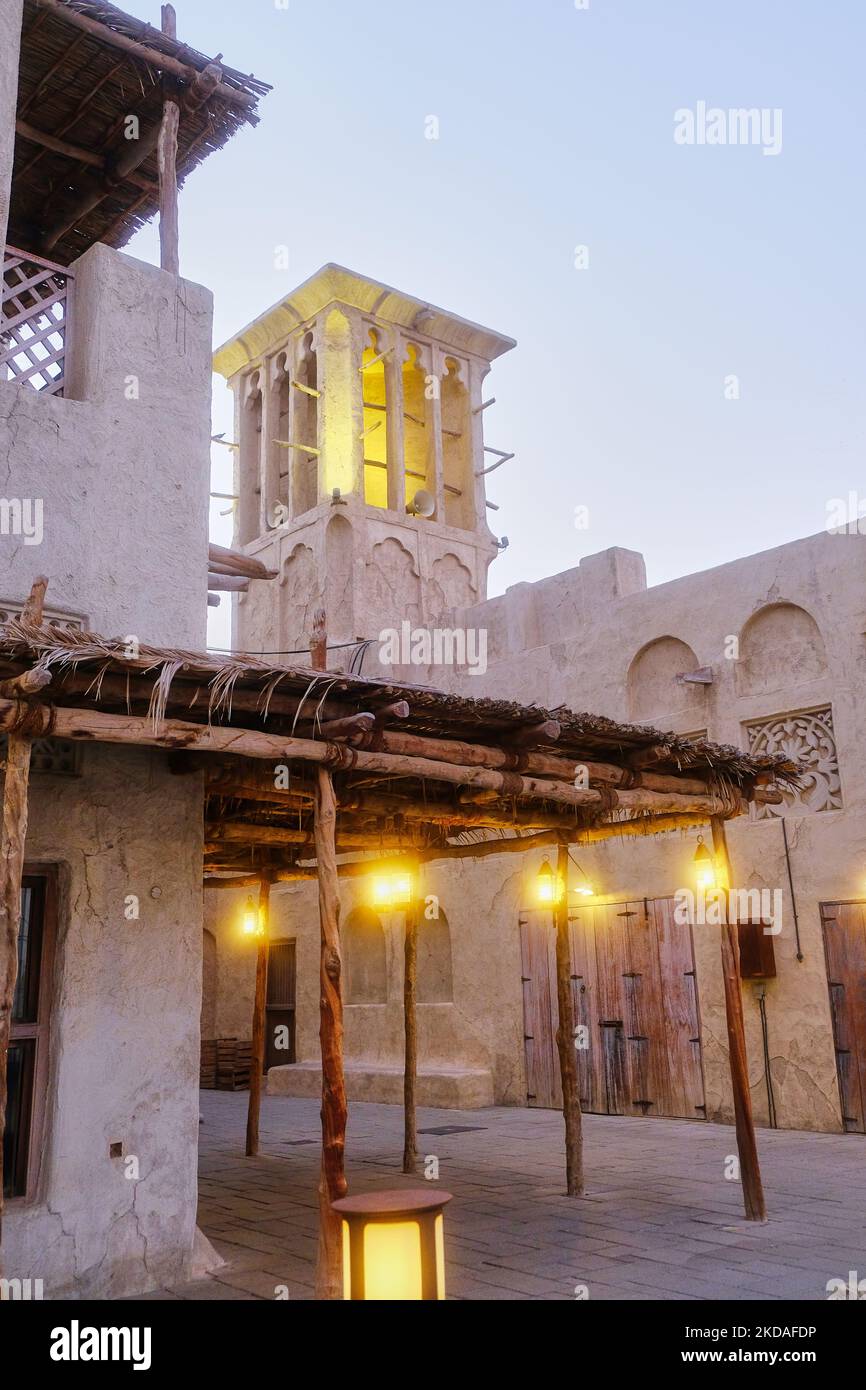 A vertical shot of an illuminated historic stone building in Dubai ...