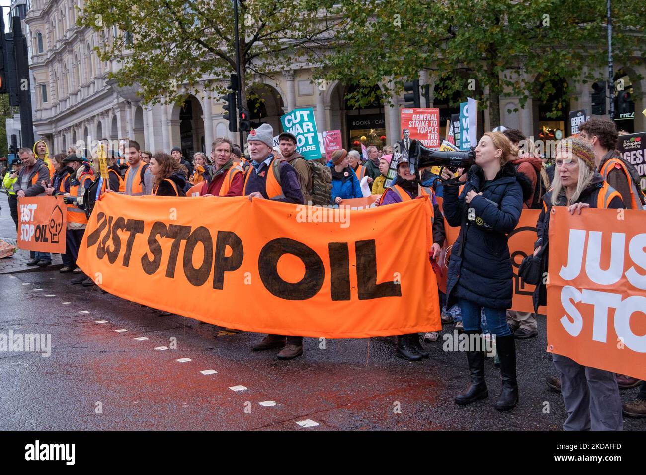 London, UK. 5 Nov 2022. Just Stop Oil protesters block the road the top ...