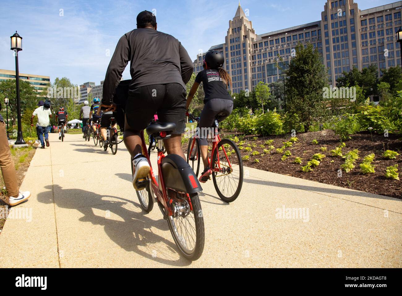 People ride bicycles alongside Washington, D.C. Mayor Muriel Bowser ...